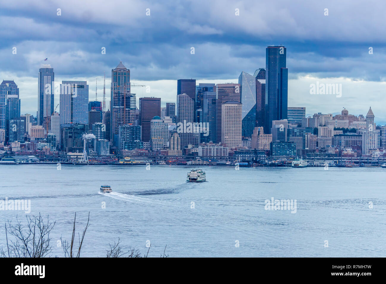 A view of the Seattle skyline with dark clouds overhead Stock Photo - Alamy