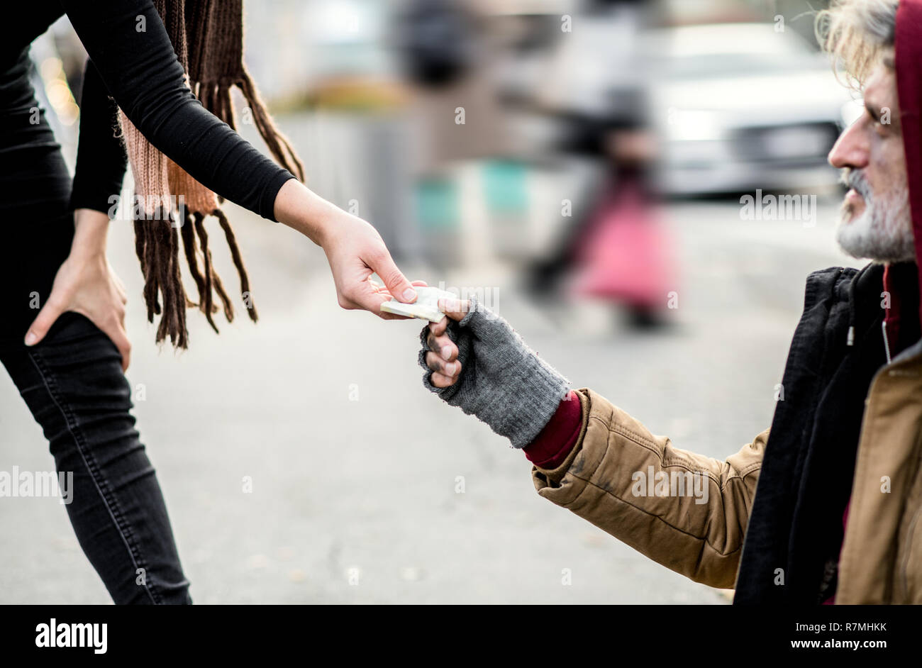 Man Giving Money To Homeless Man Giving Money To Homeless