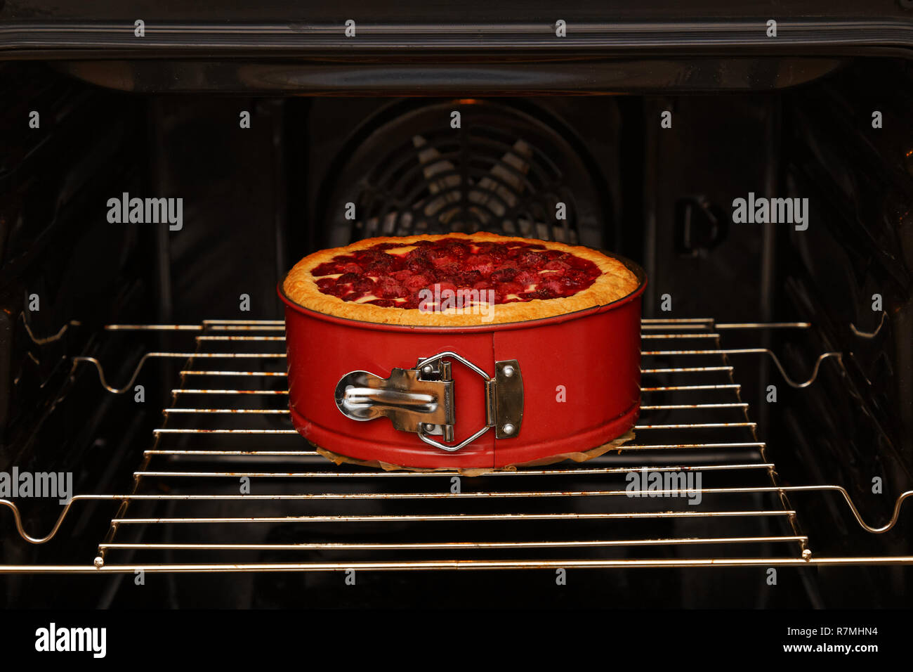 Homemade raspberry pie cooked in the domestic oven. Shallow focus Stock ...