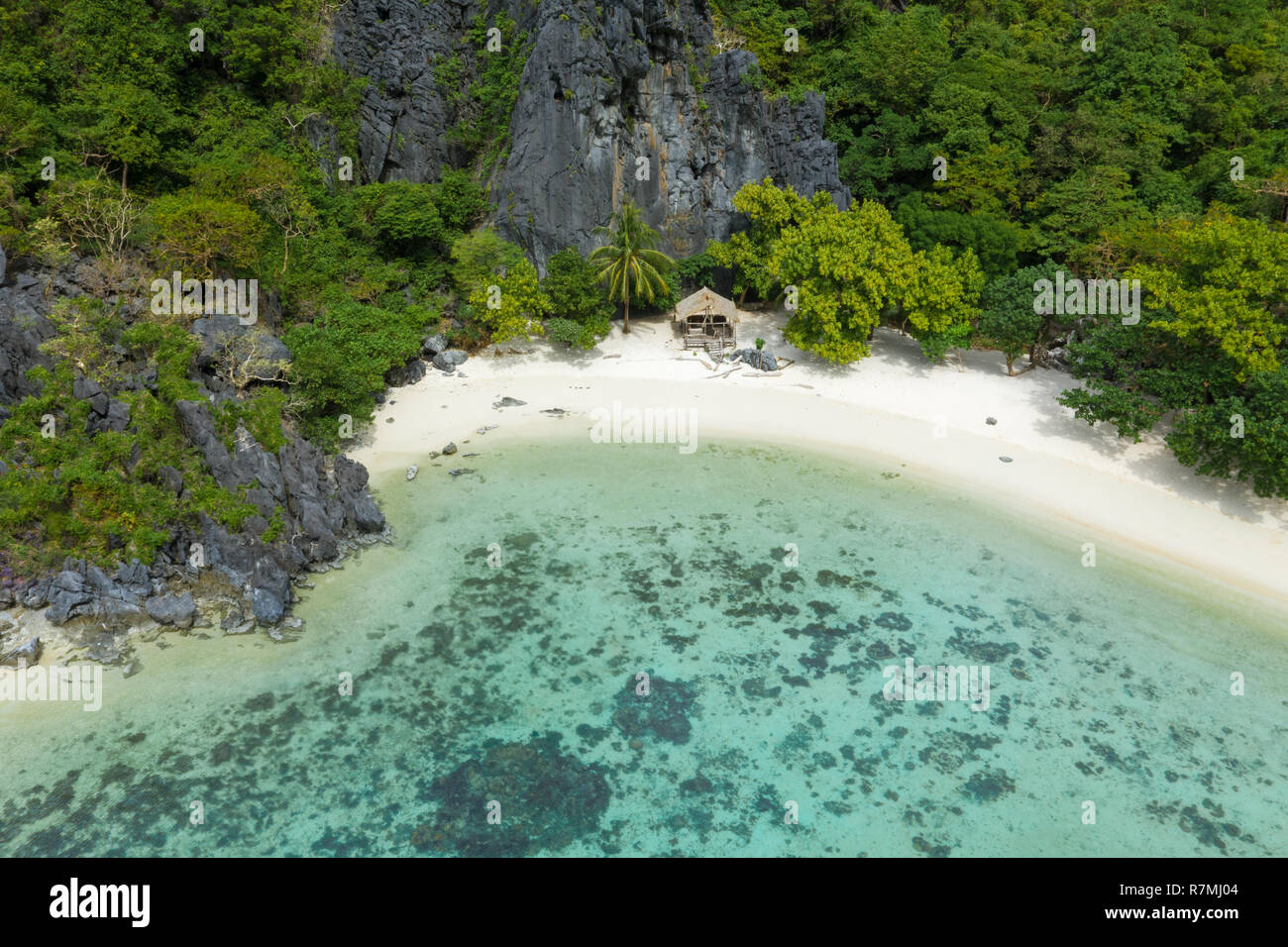 Aerial drone view of turquoise coastal waters, coral reef and limestone ...