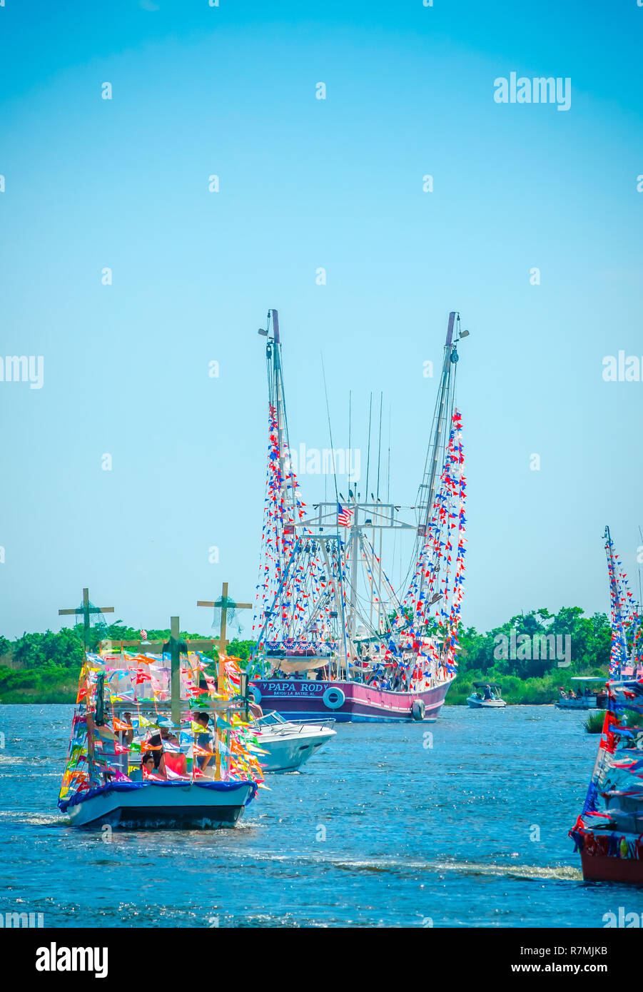 Decorated boats travel down the bayou during the Blessing of the Fleet ...