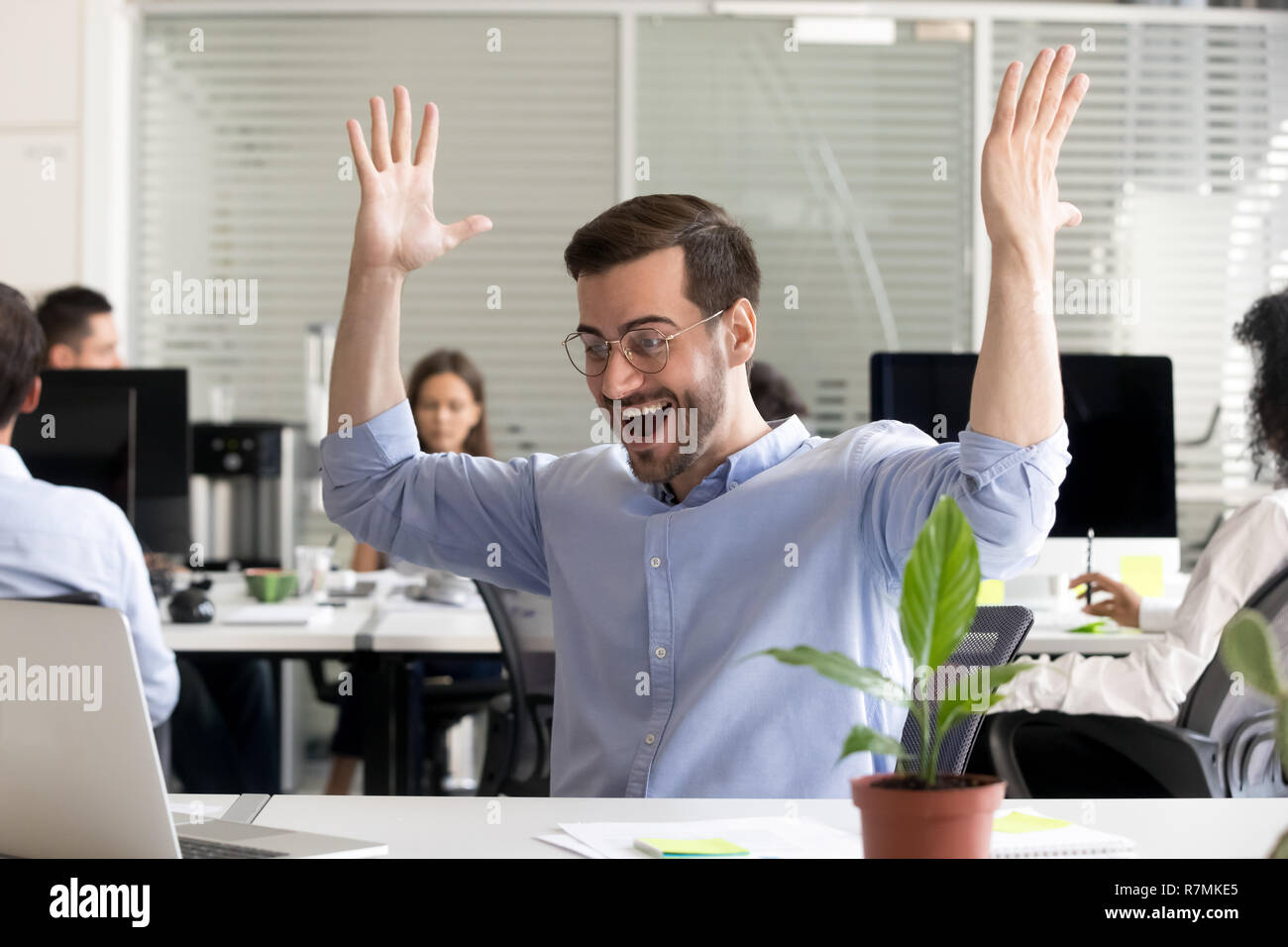 Excited happy business man celebrating business achievement Stock Photo ...