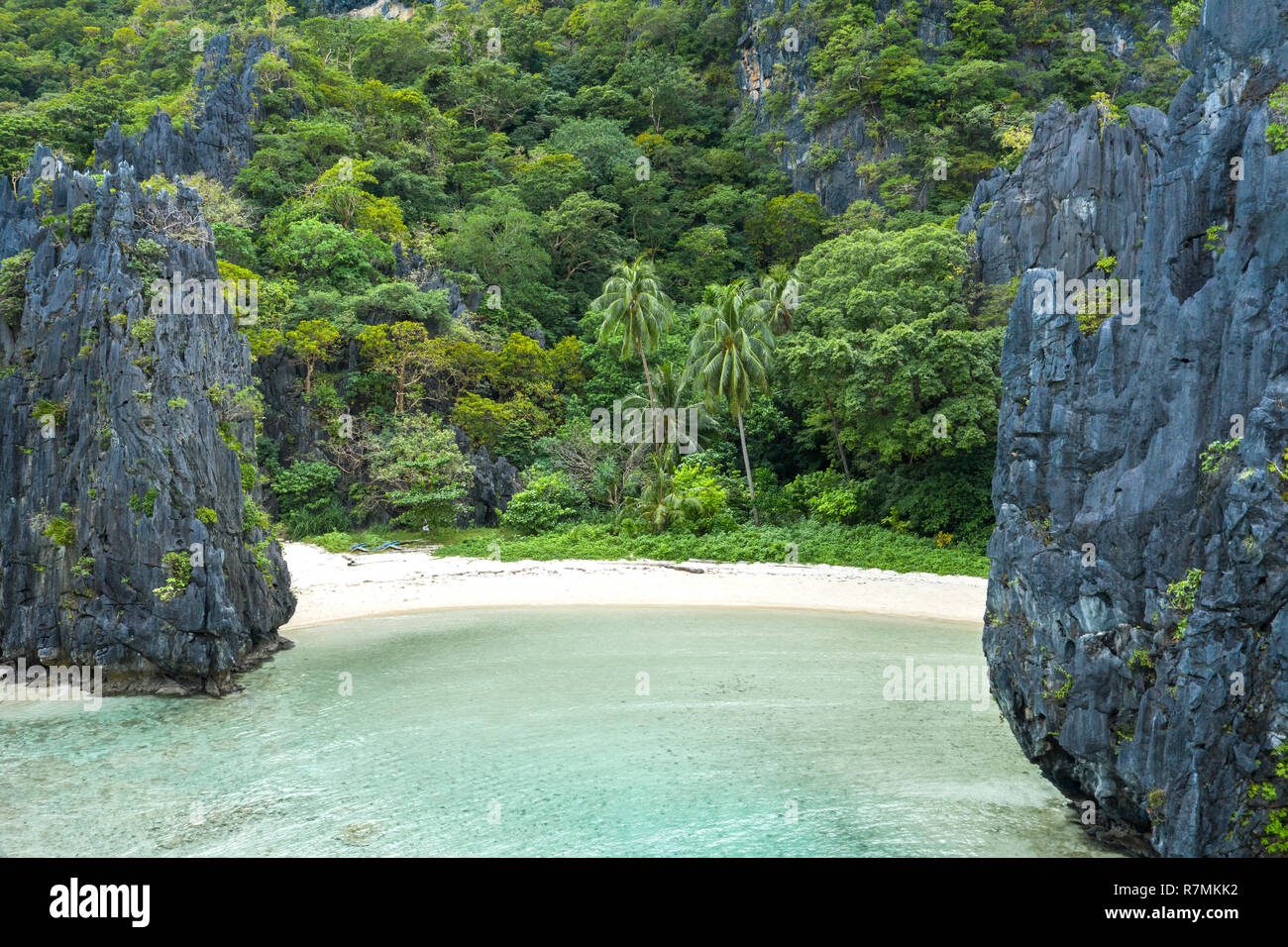 Aerial drone view of turquoise coastal waters and limestone cliffs in ...