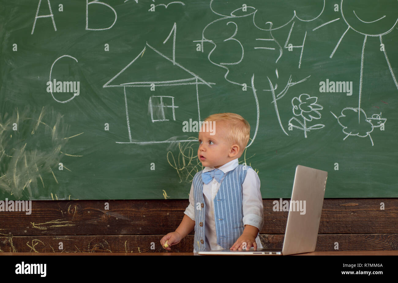 Little boy with laptop in computer class. Laptop user learn new ...