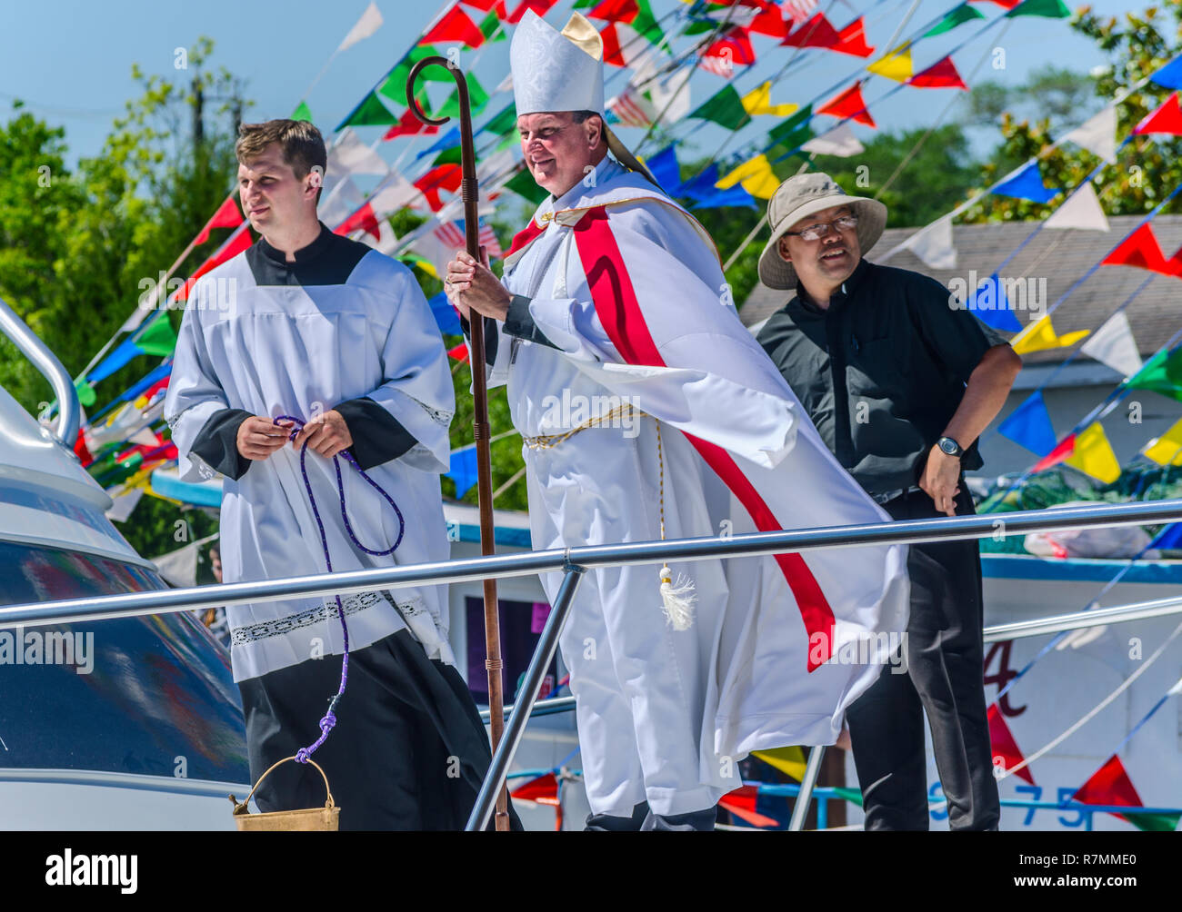 Seminarian Joey Dunbar, Catholic Archbishop Thomas J. Rodi, and Rev ...