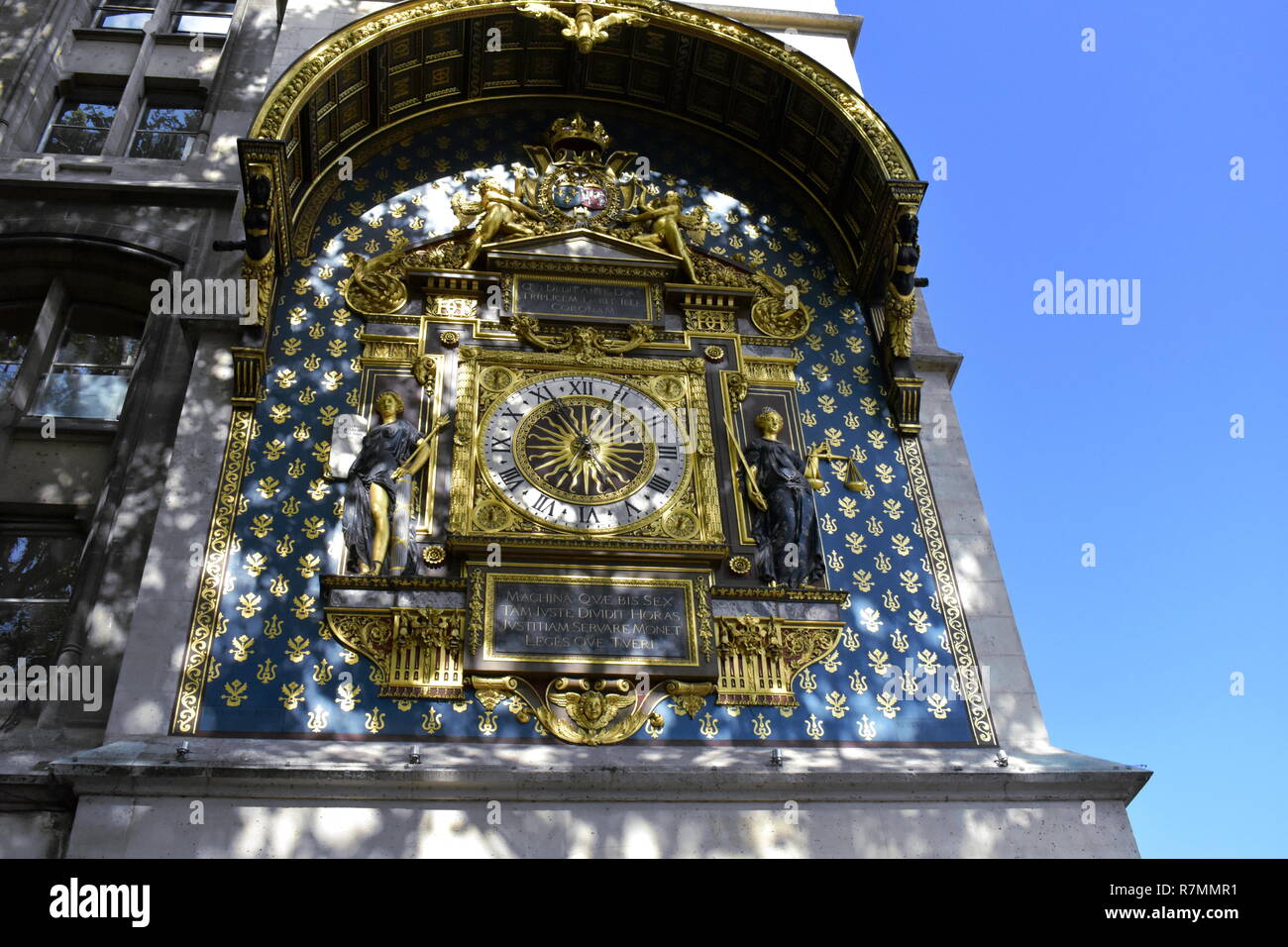 La Conciergerie, Ile de la Cite, Paris, France. Clock close-up with sun ...