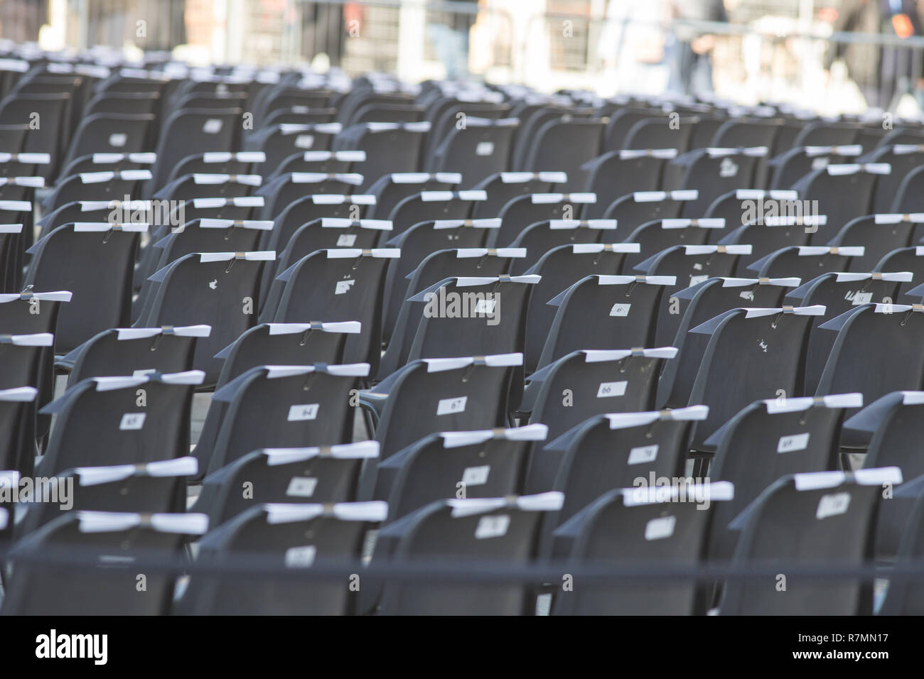 Perfectly set rows of new grey chairs. View from the back Stock Photo ...