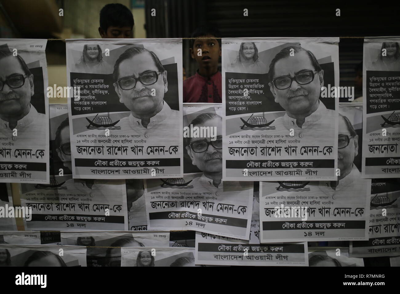 Bangladeshi boys decorate posters of Bangladesh Awami League’s MP ...