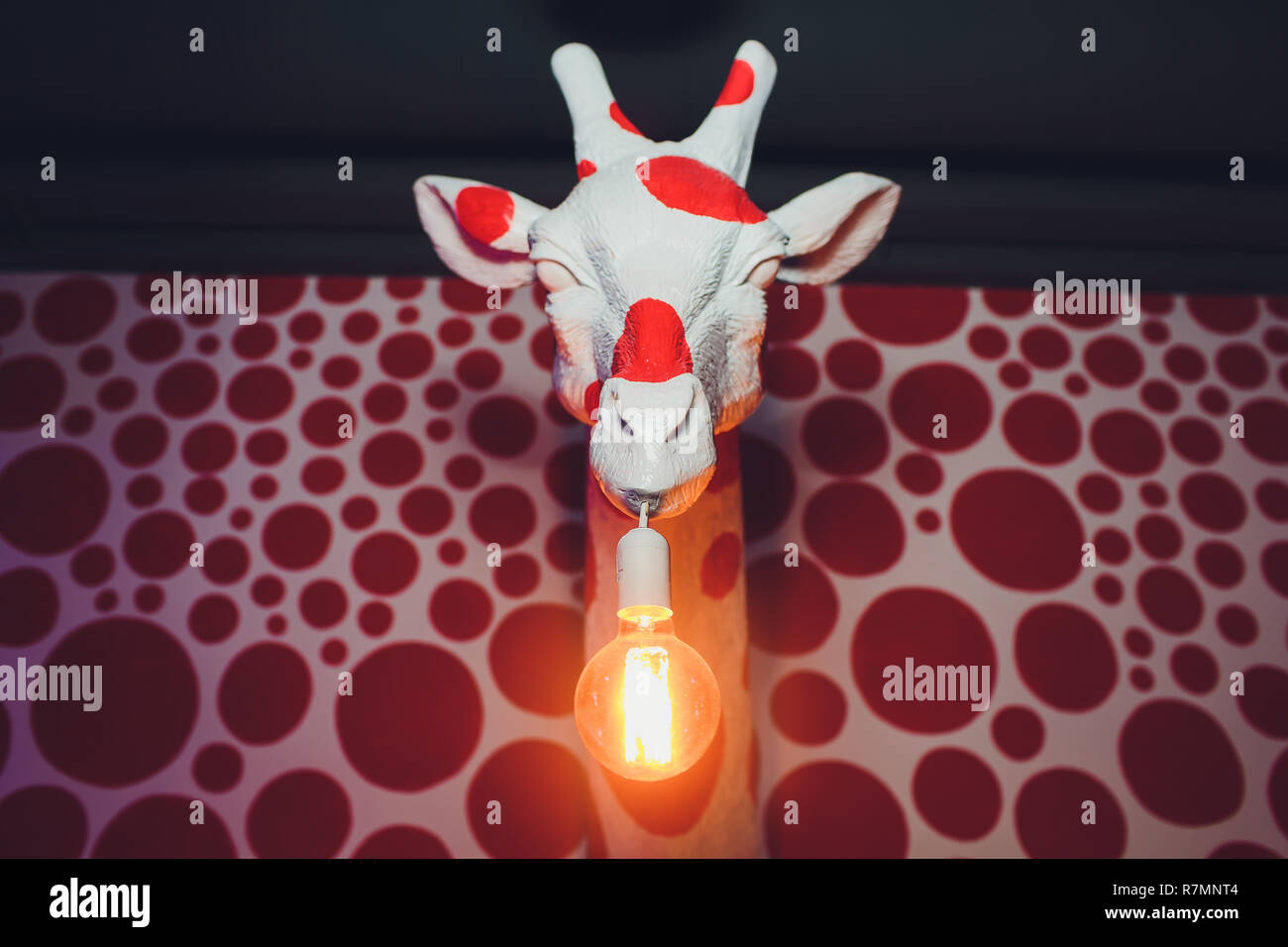 the statue Giraffe with stone wall background Stock Photo - Alamy