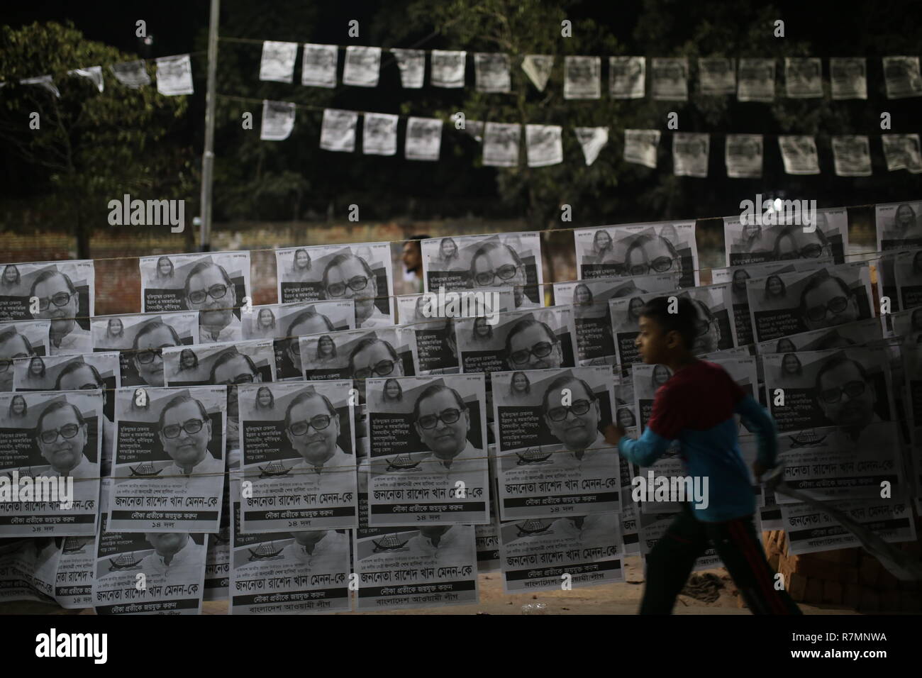 Bangladeshi boys decorate posters of Bangladesh Awami League’s MP ...