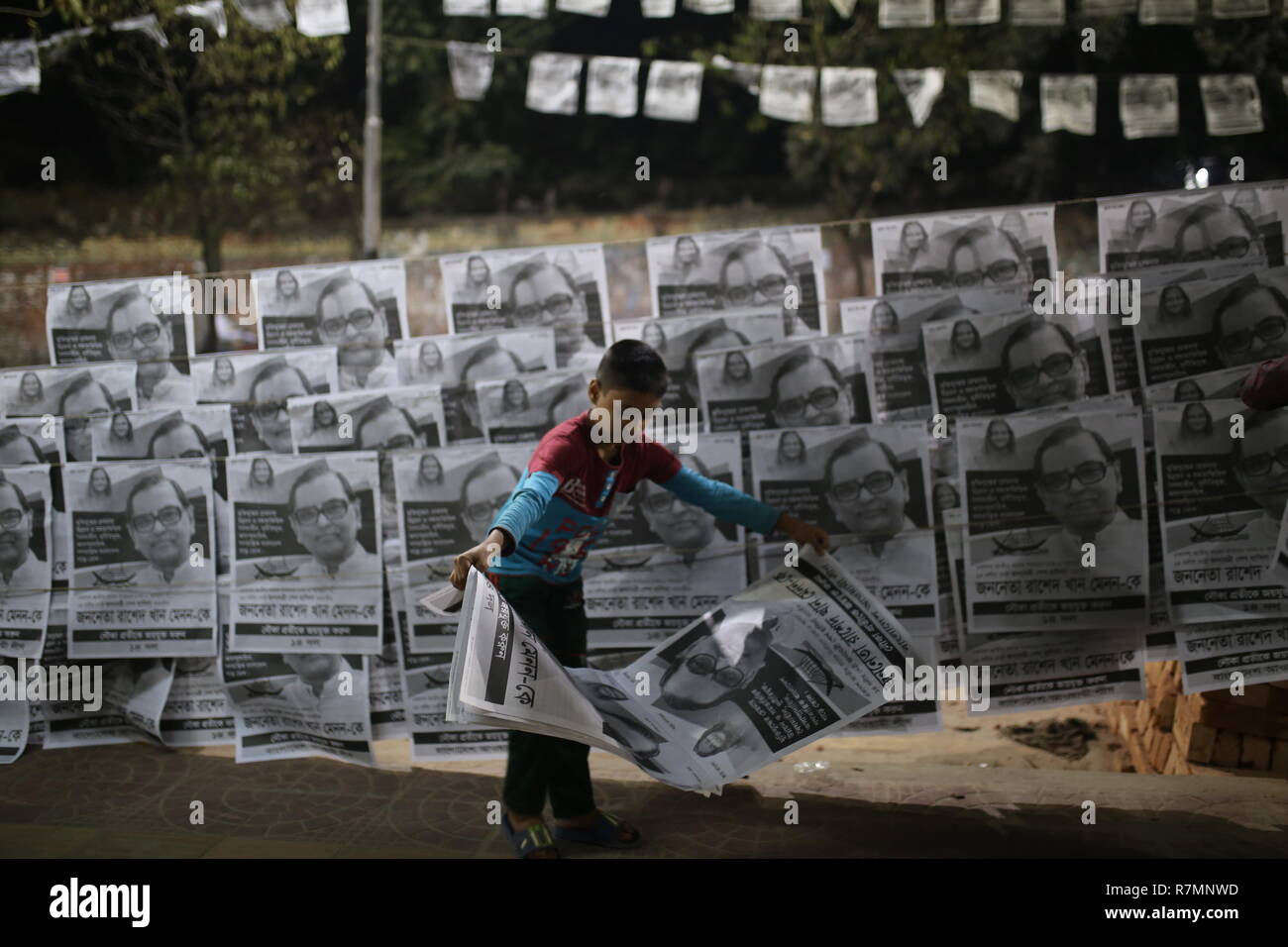 Bangladeshi boys decorate posters of Bangladesh Awami League’s MP ...