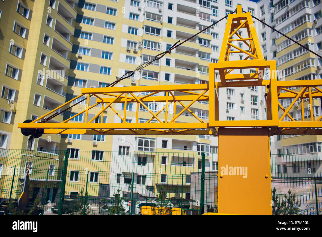Tower crane yellow color in the background of the building Stock Photo ...