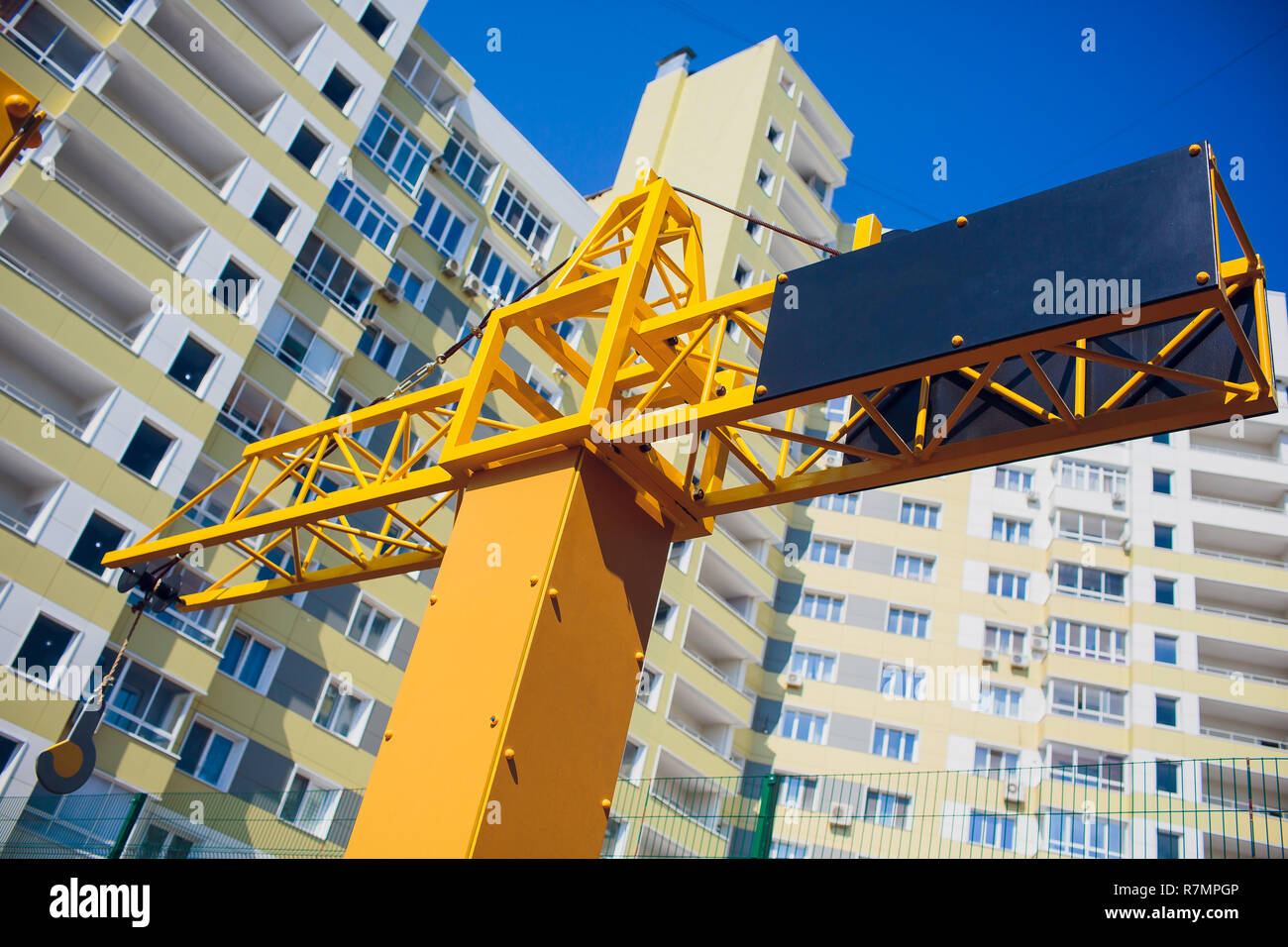 Tower crane yellow color in the background of the building Stock Photo ...