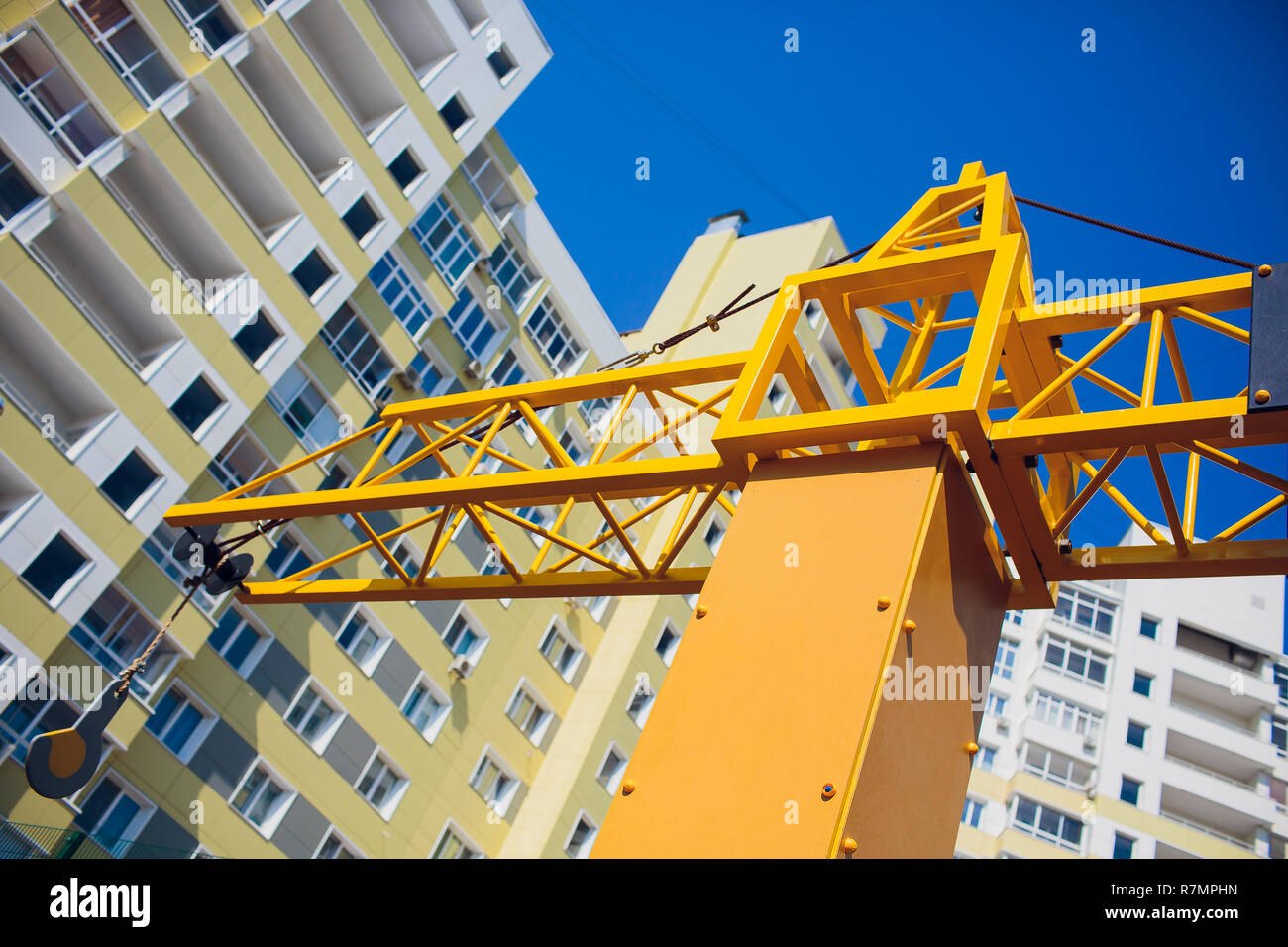 Tower crane yellow color in the background of the building Stock Photo ...