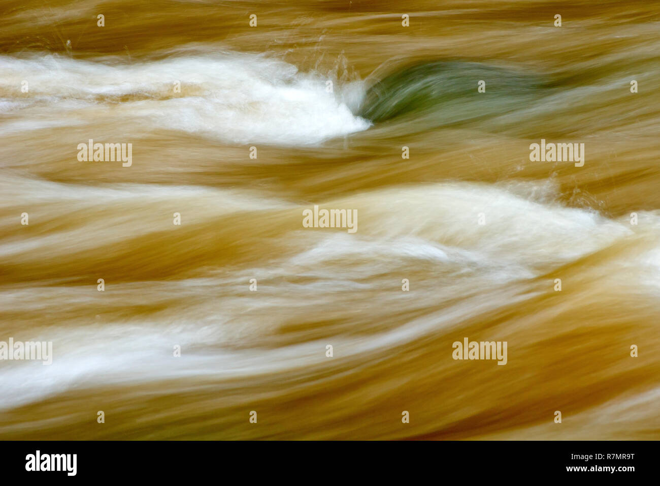 An abstract image of the Elliot Water in spate, shot with a slow ...