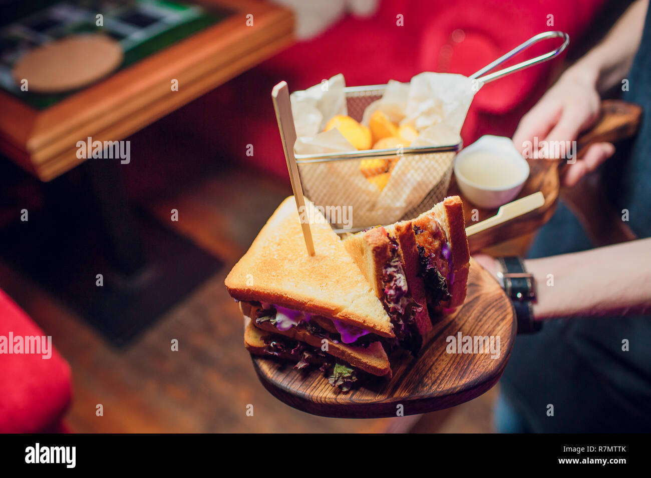 triangular sandwich. restaurant. human hand Stock Photo - Alamy