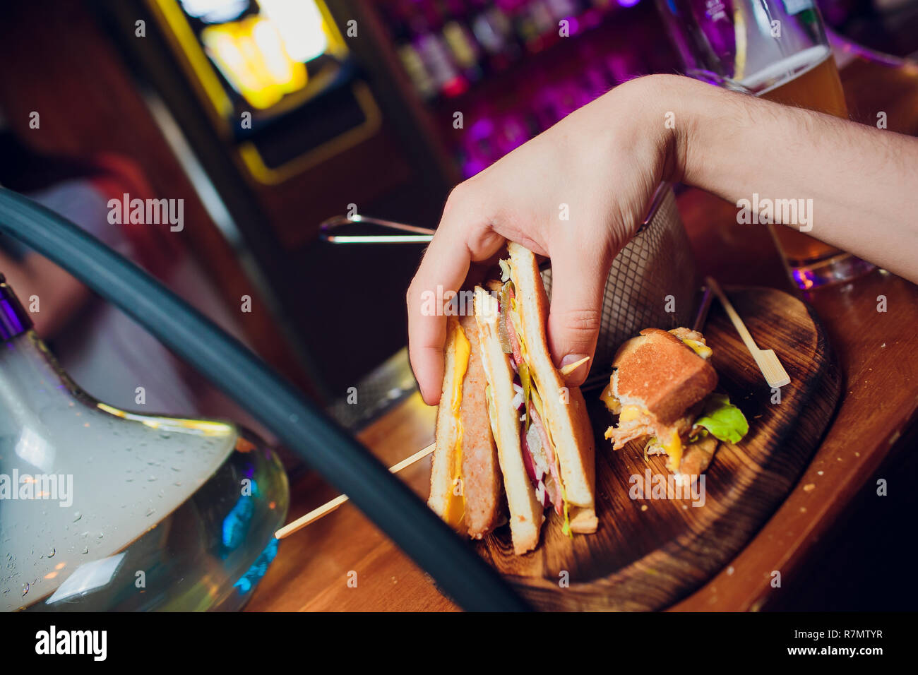 triangular sandwich. restaurant. human hand Stock Photo - Alamy
