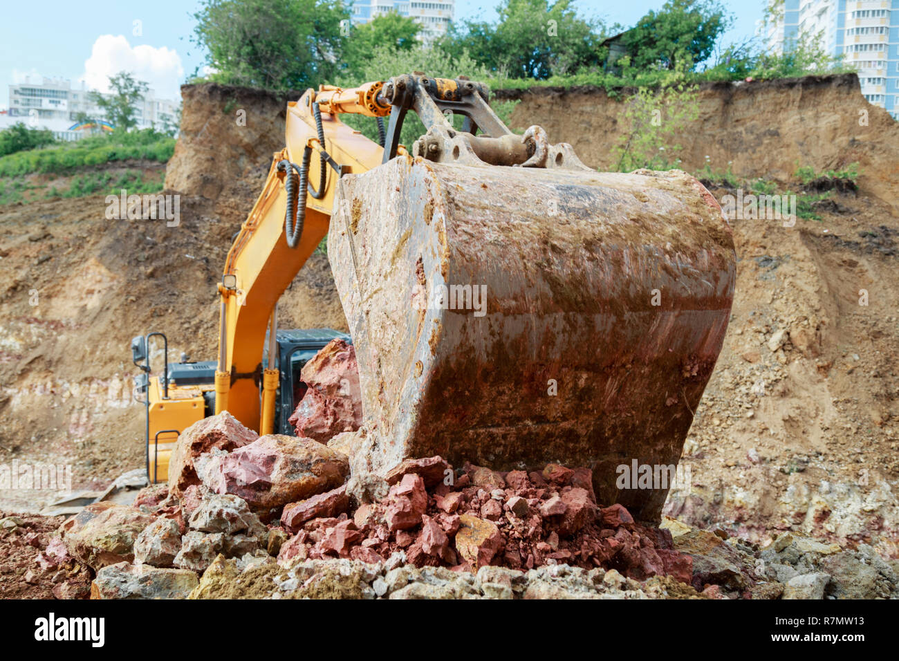 Excavator work at a construction site. Bucket closeup Stock Photo - Alamy