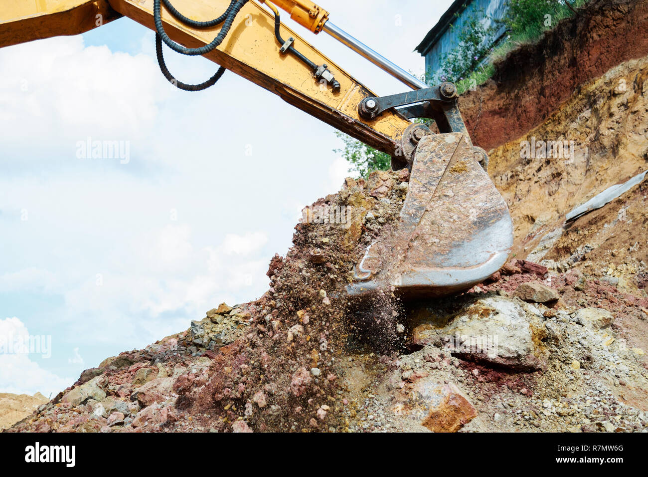Excavator work on the construction site. Bucket closeup Stock Photo - Alamy