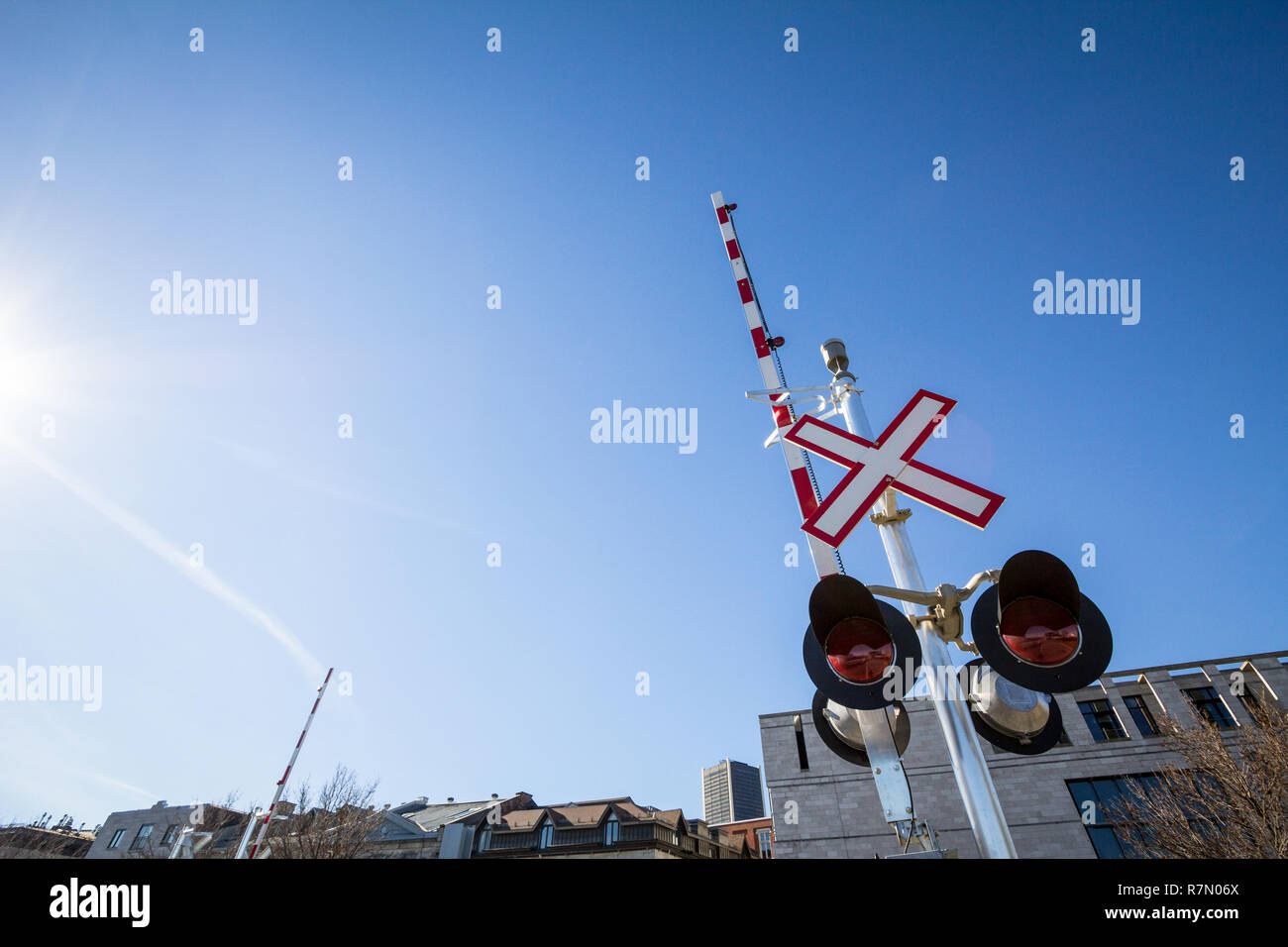 North American level crossing with its typical road sign, saltire ...