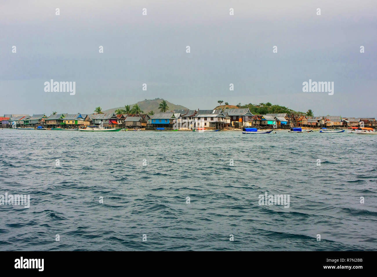 Small island with typical village in Komodo National Park, Nusa ...