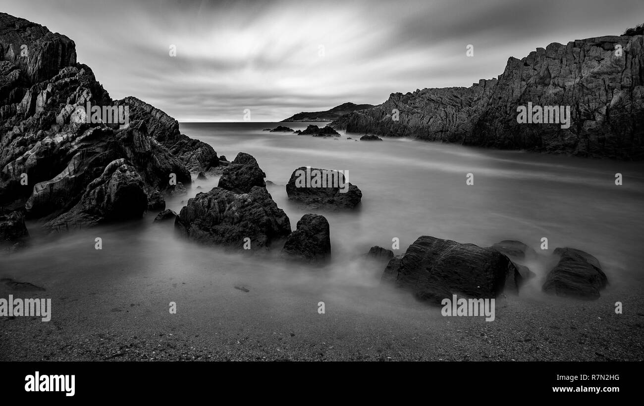 Black and White long exposure of Rocks in the sea on Wringcliff Bay in ...
