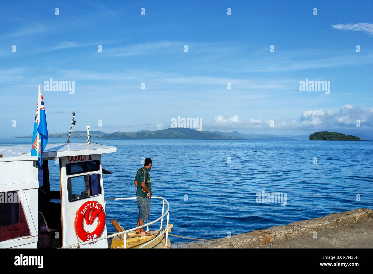 Small passenger boat docked at Korean Wharf on Taveuni Island, Fiji ...