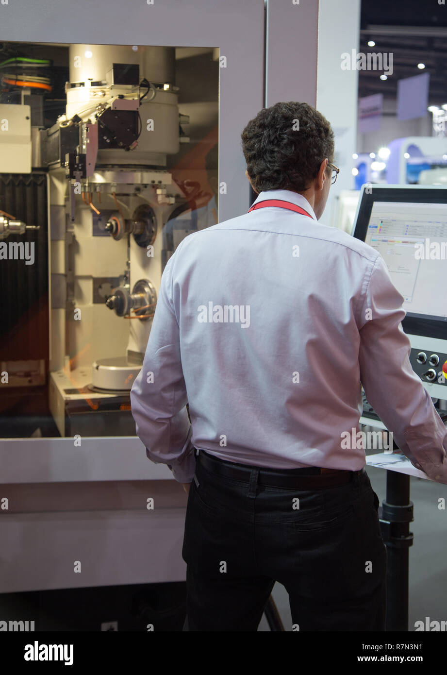 Industrial technician input data programing for Five axis CNC grinding machine Stock Photo - Alamy