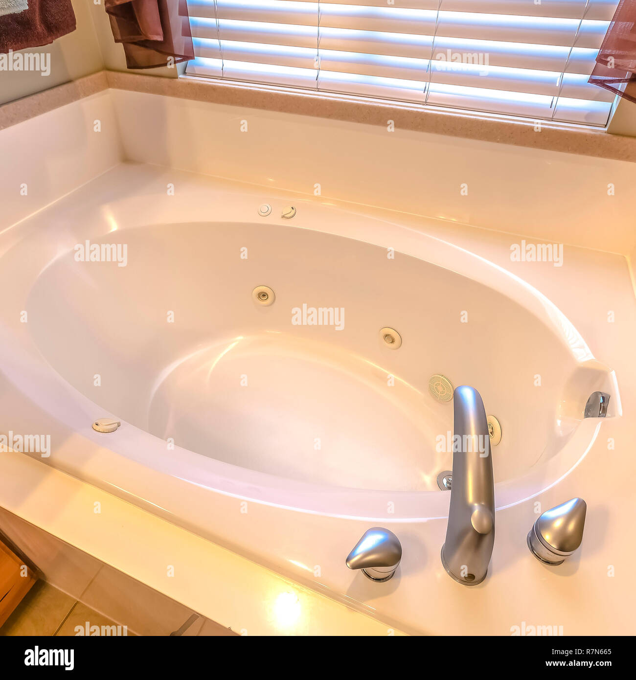 Bathtub with sunlight streaming through a window Stock Photo - Alamy
