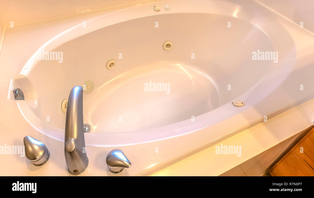 Oval shaped bathtub inside of a modern bathroom Stock Photo - Alamy