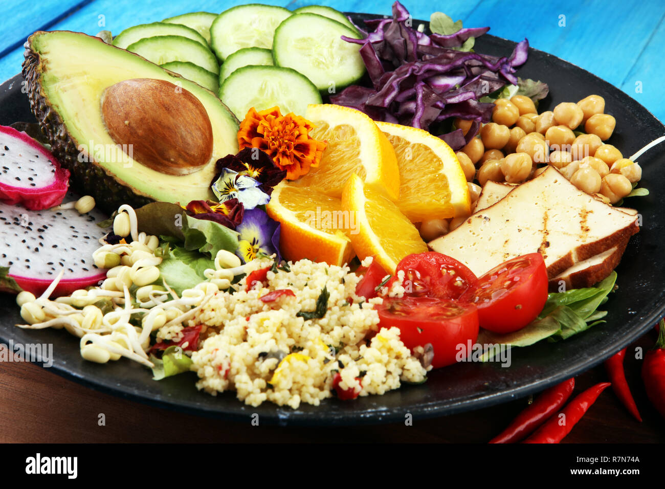 grilled tofu and dragon fruit buddha bowl with vegetable and humus ...