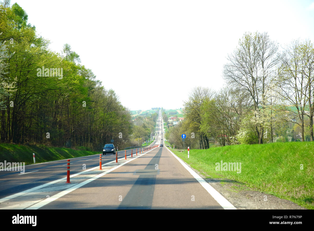 A long and straight section of a public road near Piaski Stock Photo ...