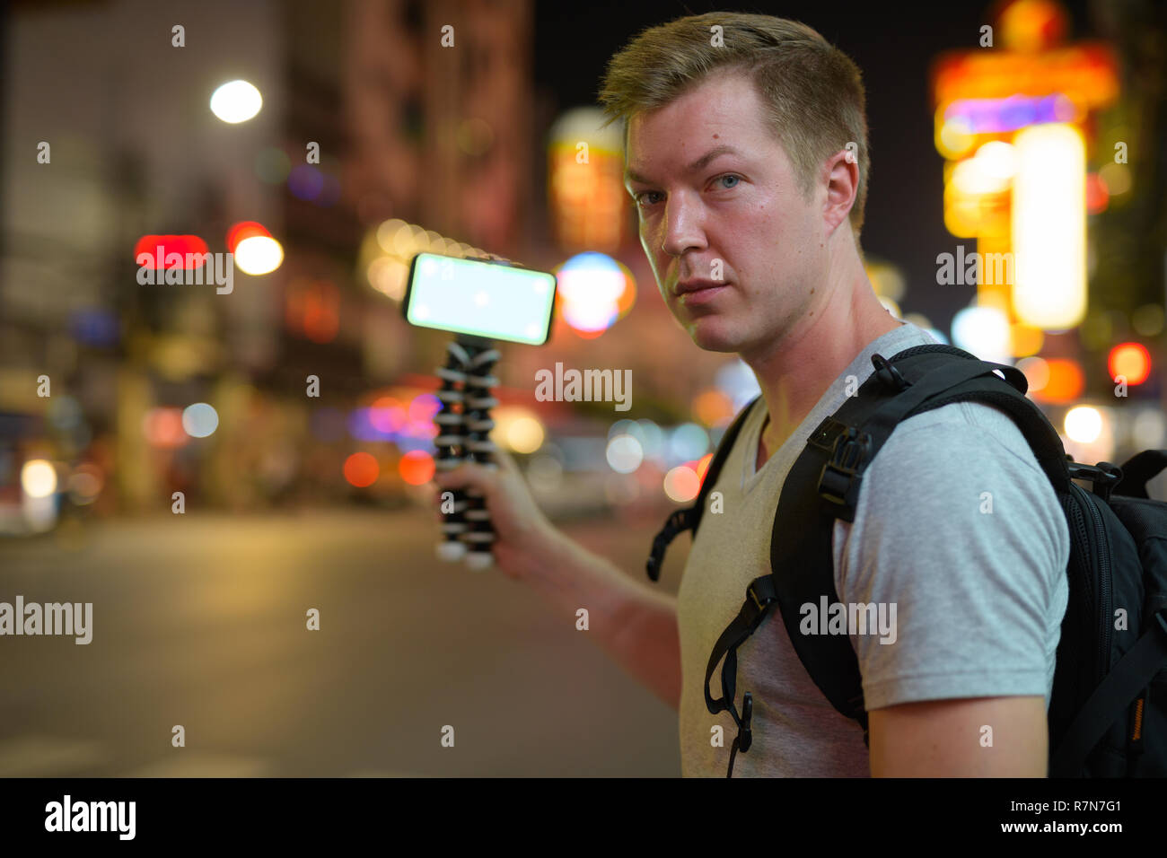 Young tourist man vlogging in the streets of Chinatown at night Stock ...