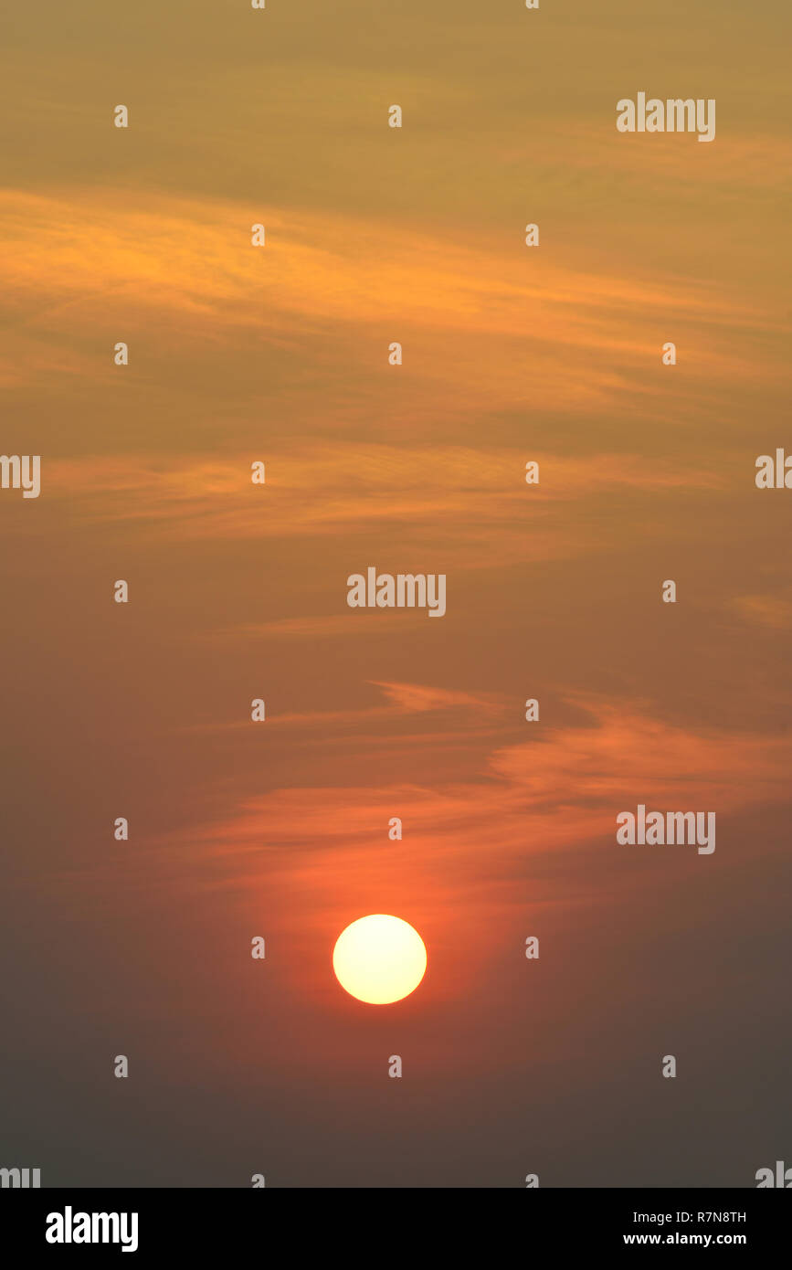 big sun on the sky with clouds background Stock Photo - Alamy