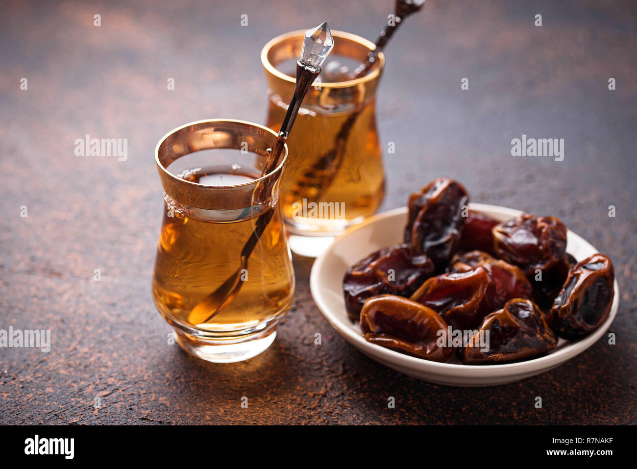 Traditional arabic tea and dry dates Stock Photo - Alamy