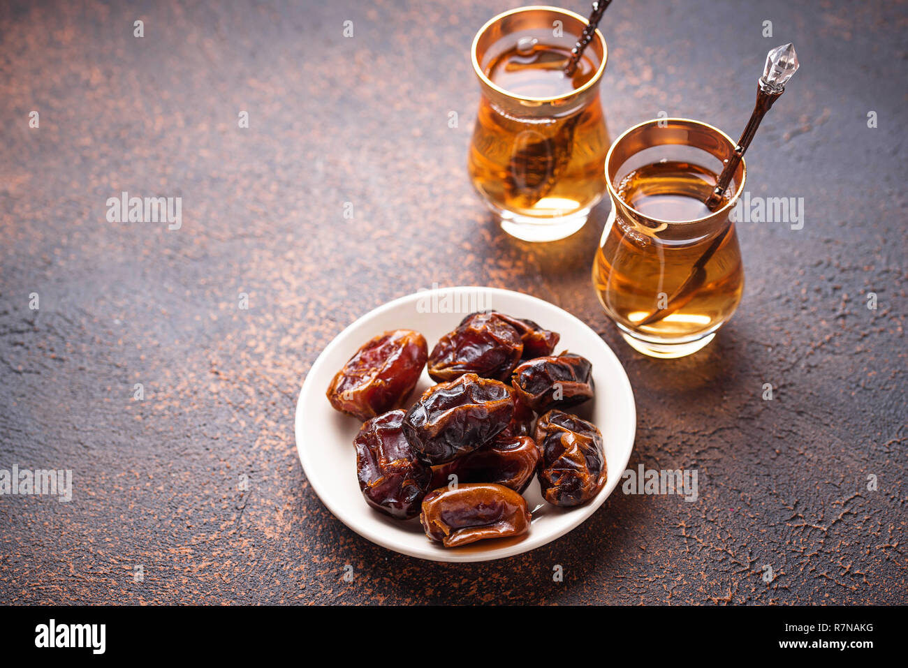 Traditional arabic tea and dry dates Stock Photo - Alamy