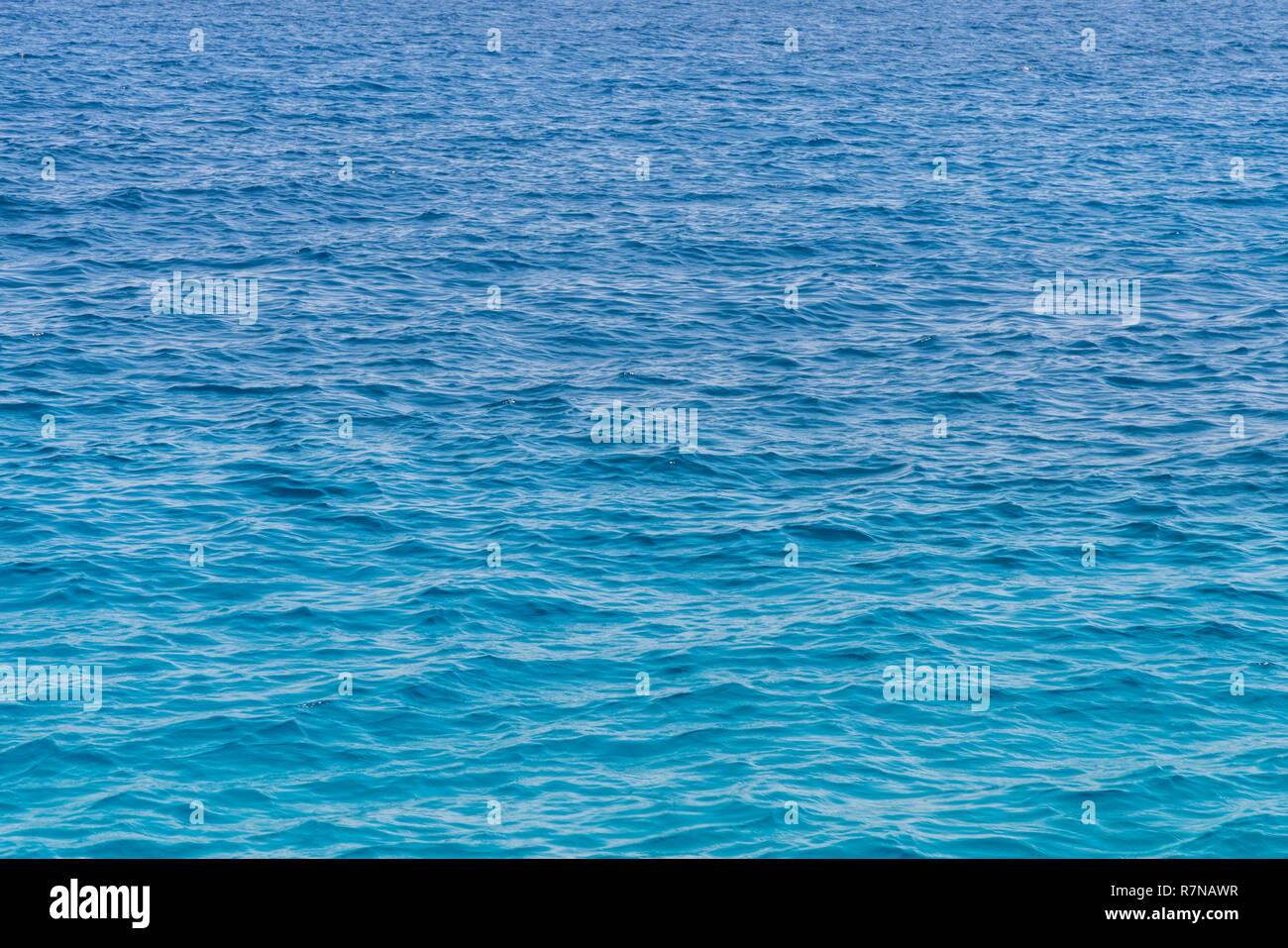 Blue sea background. Blue sea surface with waves Stock Photo - Alamy