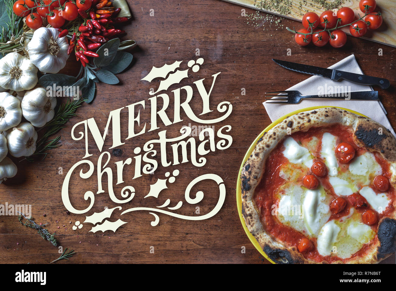 Merry christmas words on top view frame christmass table with pizza ...