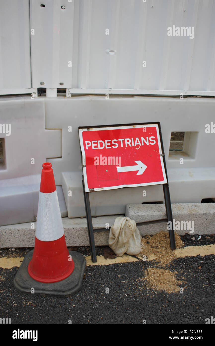 Pedestrian Dented Metal Roadwork Sign and Traffic Cone Stock Photo - Alamy