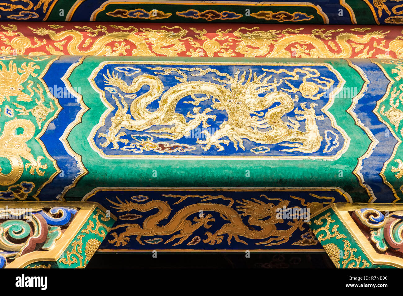 Architectural detail with a chinese golden dragon painted on the ...