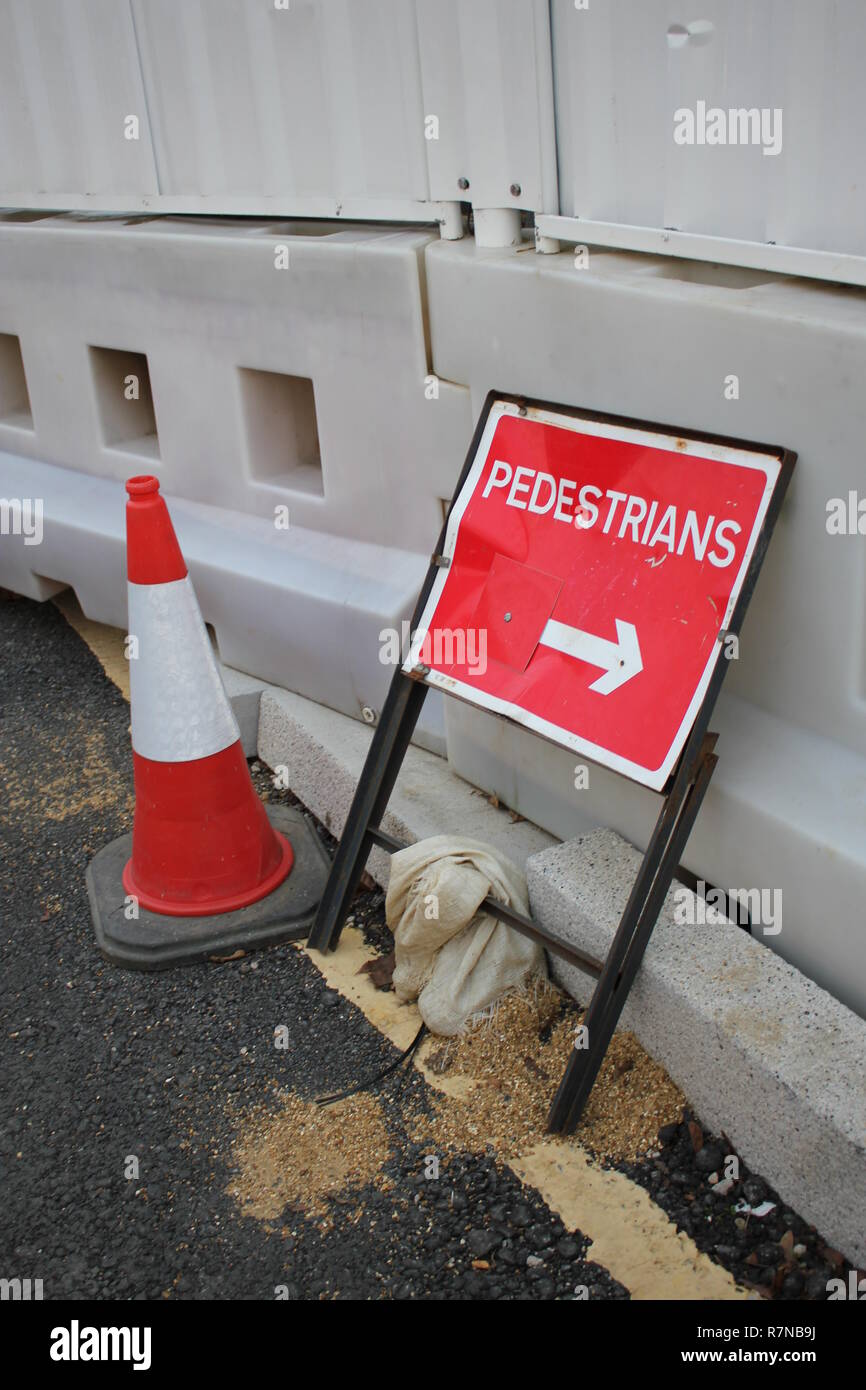 Pedestrian Dented Metal Roadwork Sign and Traffic Cone Stock Photo - Alamy