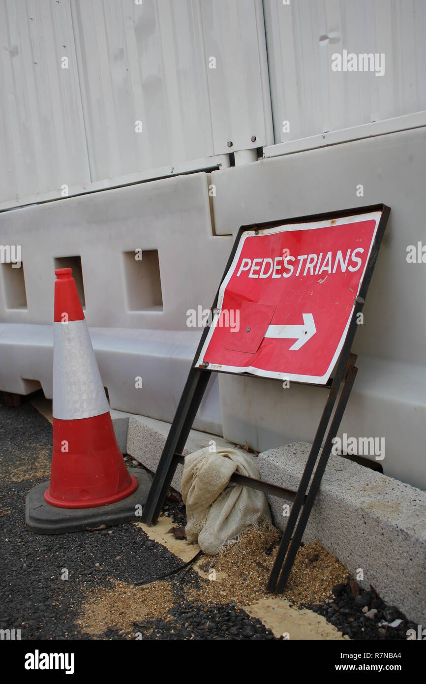 Pedestrian Dented Metal Roadwork Sign and Traffic Cone Stock Photo - Alamy