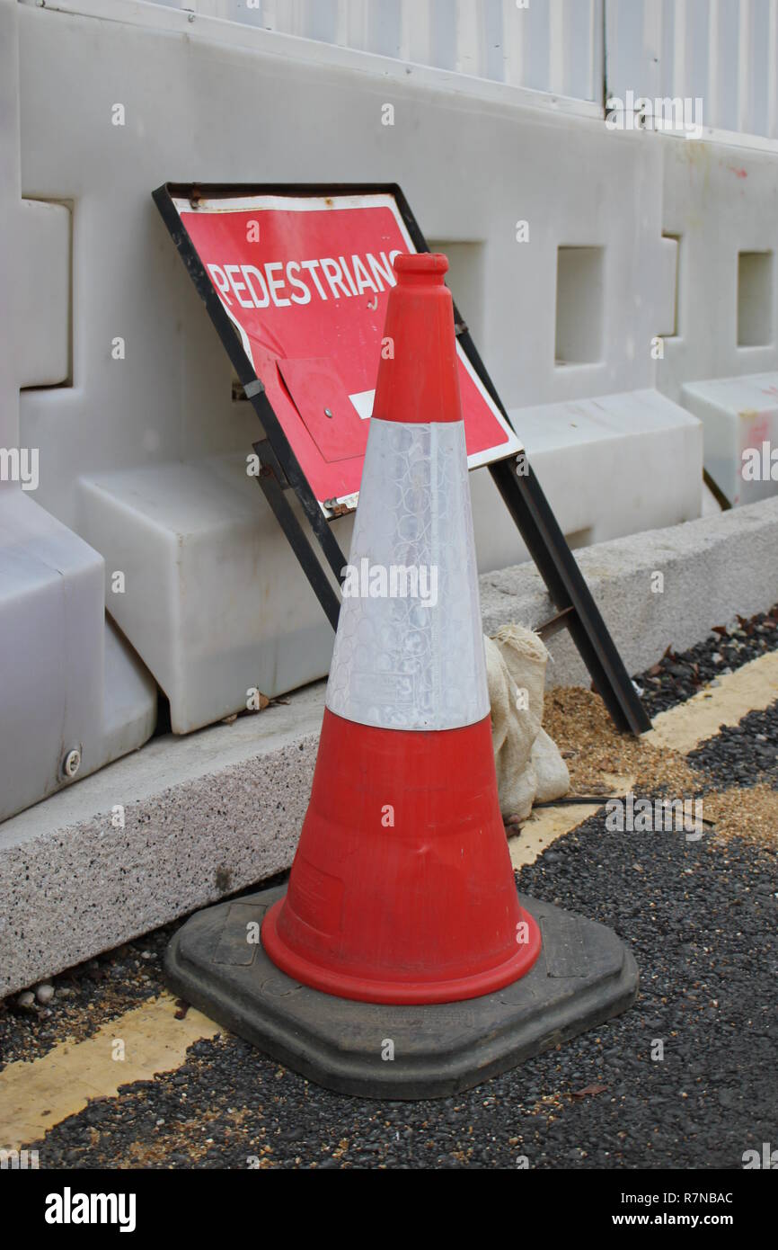 Pedestrian Dented Metal Roadwork Sign and Traffic Cone Stock Photo - Alamy