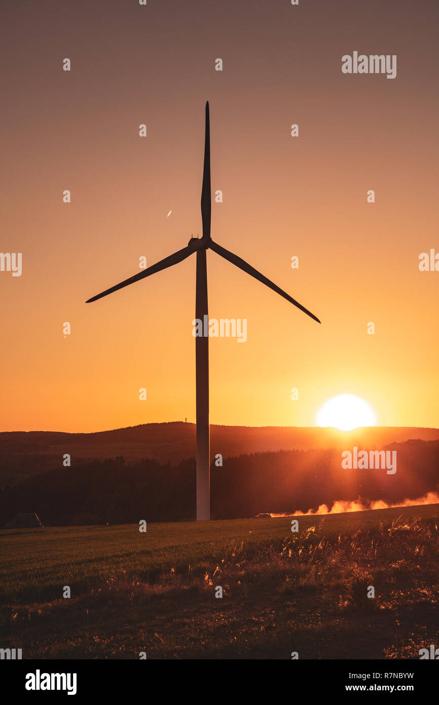 Wind turbine at sunset Stock Photo - Alamy