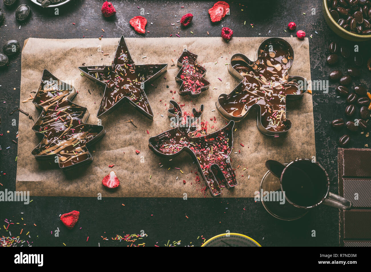 Homemade Christmas chocolate bars making. Christmas cutters with ...