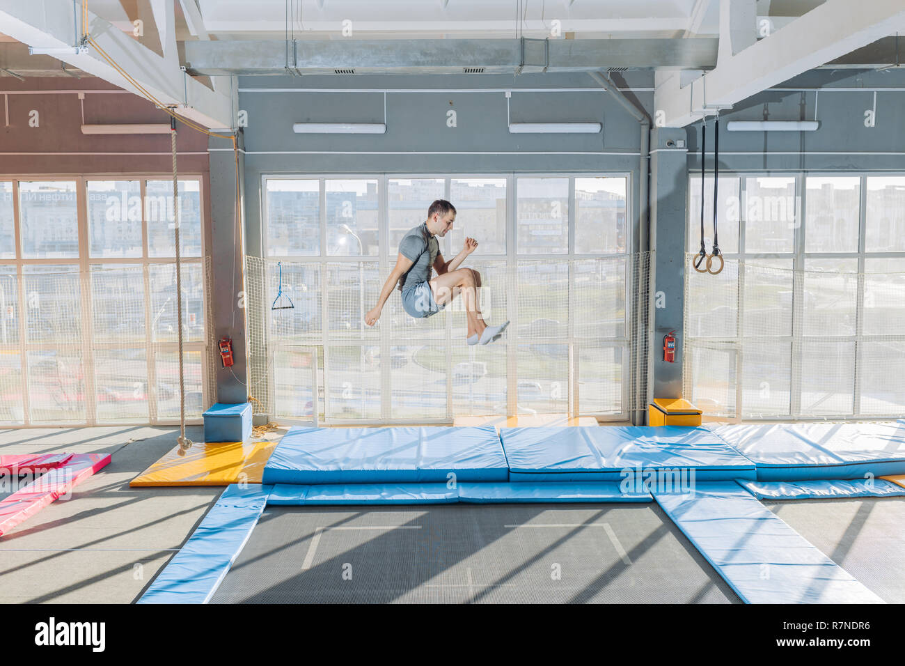 high jump attempt. young gorgeous man jumping with a long run Stock ...