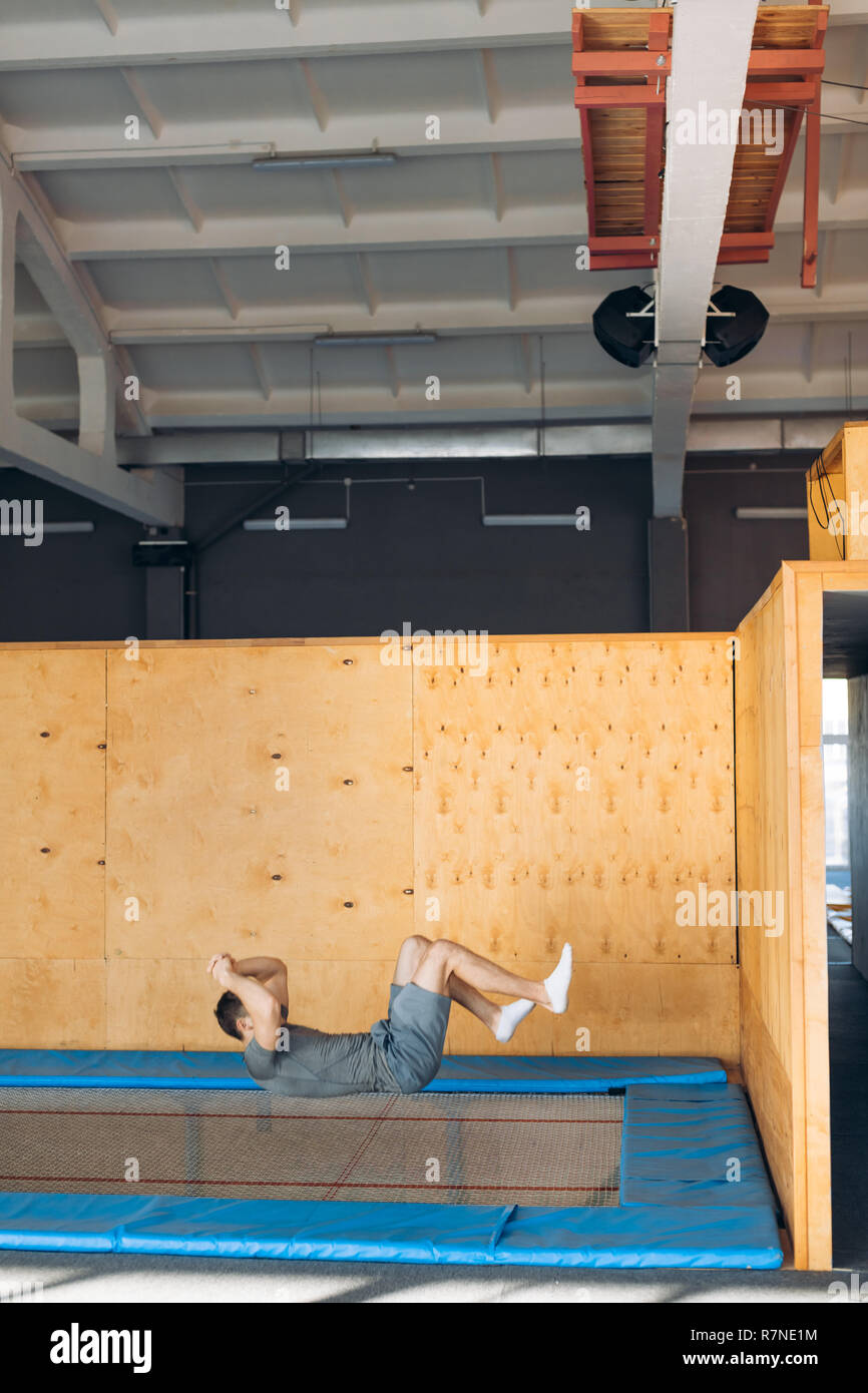 man is falling on the mat after climbing Stock Photo - Alamy