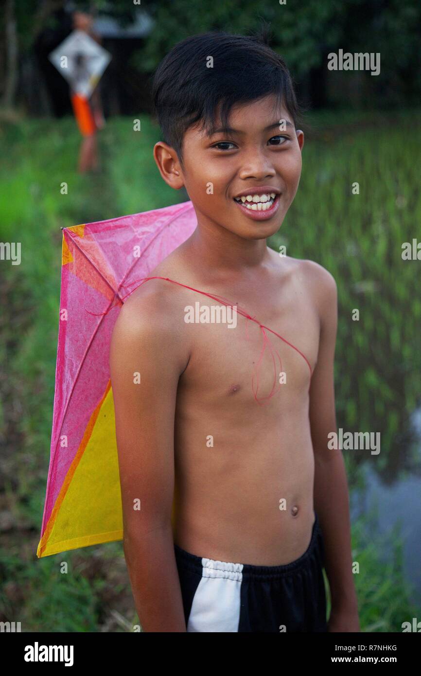 Indonesia, Java, Ijen, Boy with a kite in the back, in the middle of ...