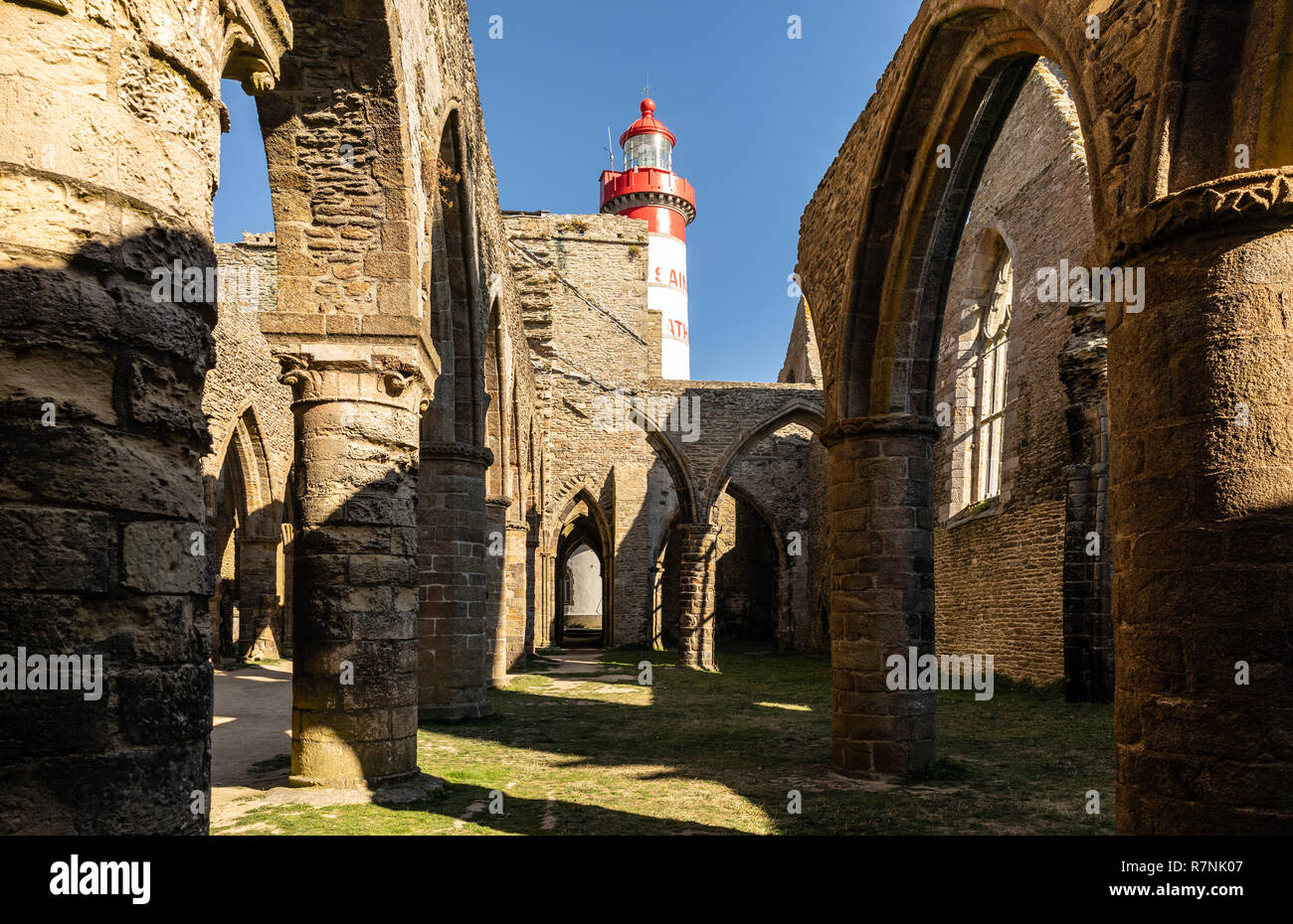 The Saint-Mathieu lighthouse behind the ruins of the abbey Saint ...