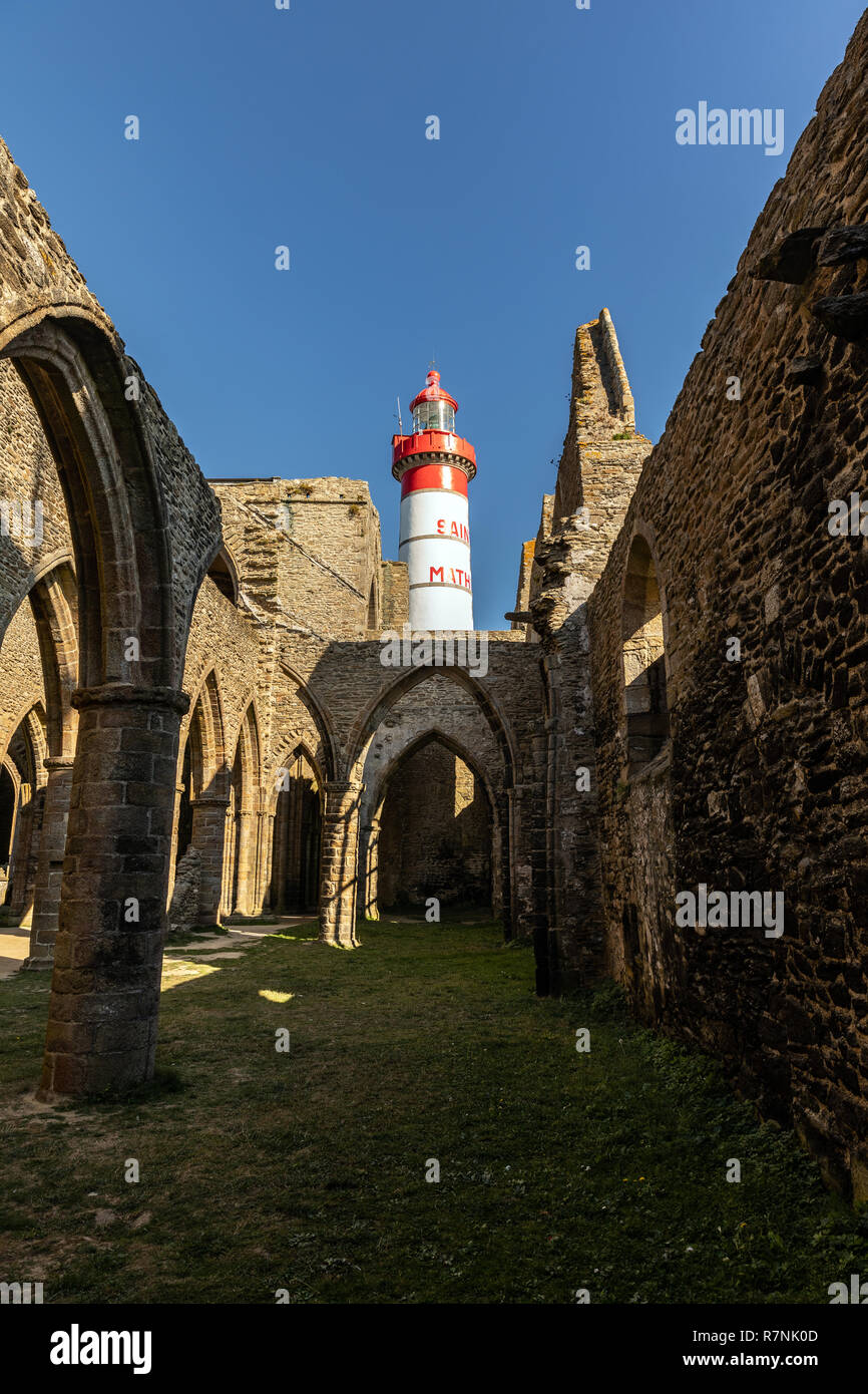 The Saint-Mathieu lighthouse behind the ruins of the abbey Saint ...
